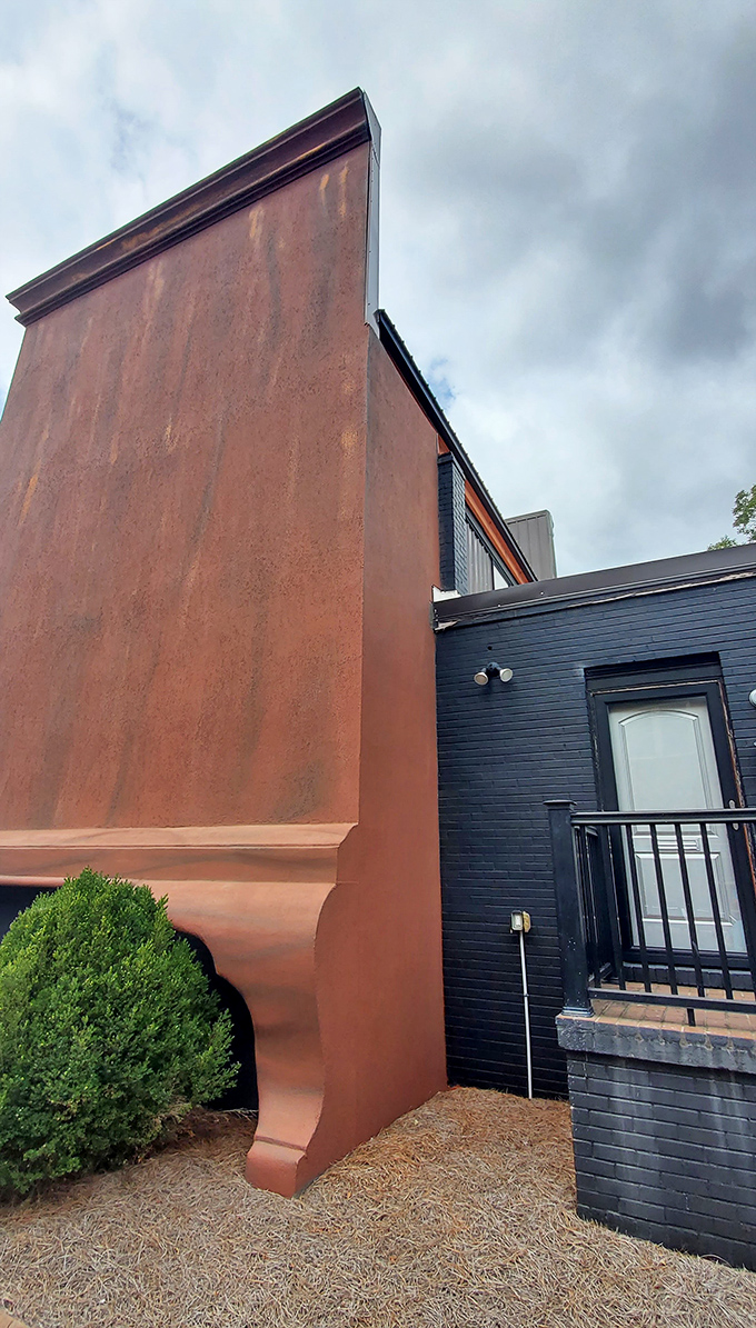 The side view reveals just how massive this landmark truly is&mdash;like standing next to the Empire State Building of bedroom furniture.