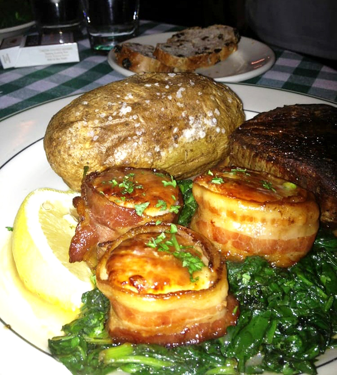 Bacon-wrapped scallops nestled beside a steak&mdash;proof that sometimes the best relationships are the ones that sizzle together.