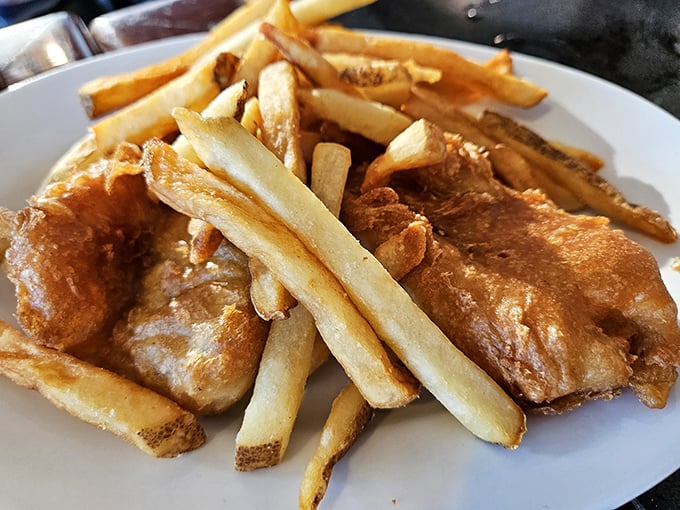 Fish and chips done right&mdash;golden, crispy batter protecting flaky white fish. The kind that makes you wonder why you ever settled for less. 