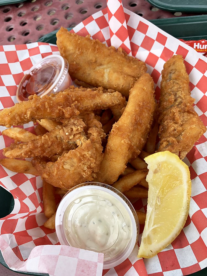 These golden fish fillets aren't just fried&mdash;they're transformed into crispy vessels of oceanic delight, with fries standing by for the perfect supporting role.