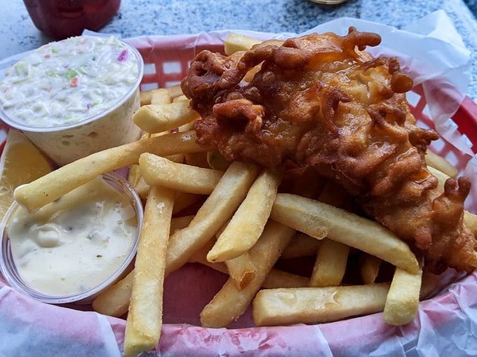 Golden-battered fish nestled on a bed of crispy fries&mdash;comfort food that whispers "vacation" even if you're just on your lunch break.
