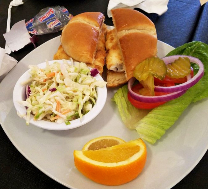 A proper fish sandwich with all the fixings &ndash; proof that sometimes the simplest pleasures are worth crossing state lines for.