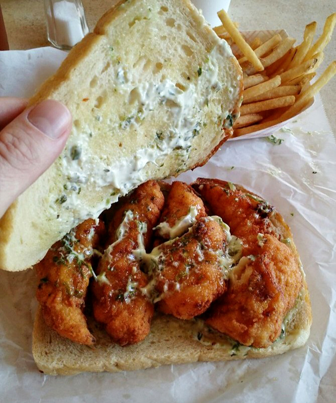 This isn't just fried fish on bread; it's a masterclass in seafood simplicity&mdash;crispy, golden fillets with tartar sauce that demands to be savored.