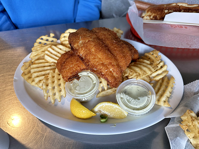 Golden-brown perfection meets waffle fries in a dish that would make Captain Ahab forget all about that whale.