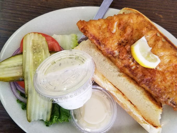 The fish sandwich comes with the kind of golden-brown perfection that makes you wonder why you'd ever settle for fast food fish again.