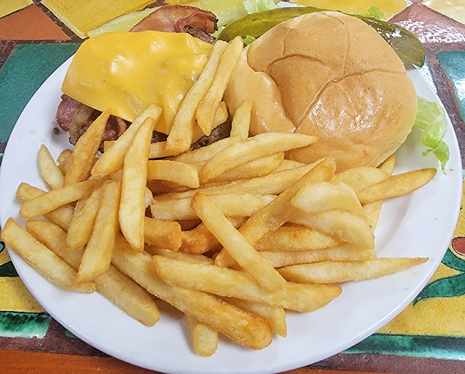 These aren't just fries&mdash;they're golden happiness sticks, perfectly crisp companions to a burger that means business.