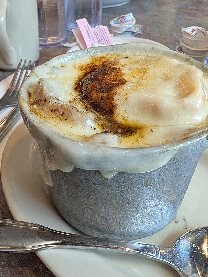 This isn't just French onion soup&mdash;it's a volcanic masterpiece of cheese and broth that demands a moment of respectful silence before diving in.