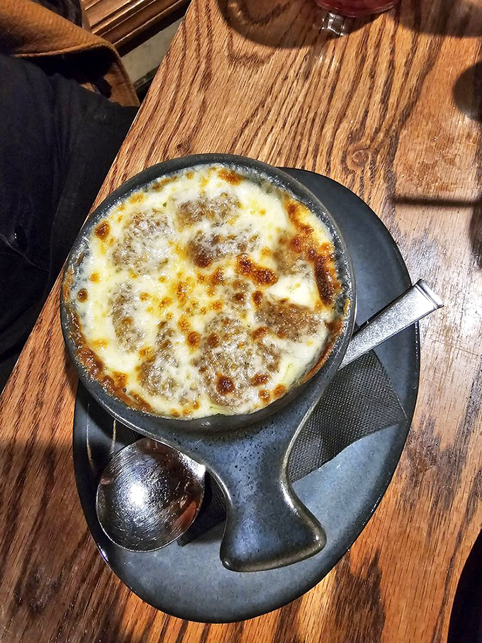 The holy grail of comfort food! That cheese pull could win Olympic medals, while the broth beneath holds secrets only patient onions can tell.