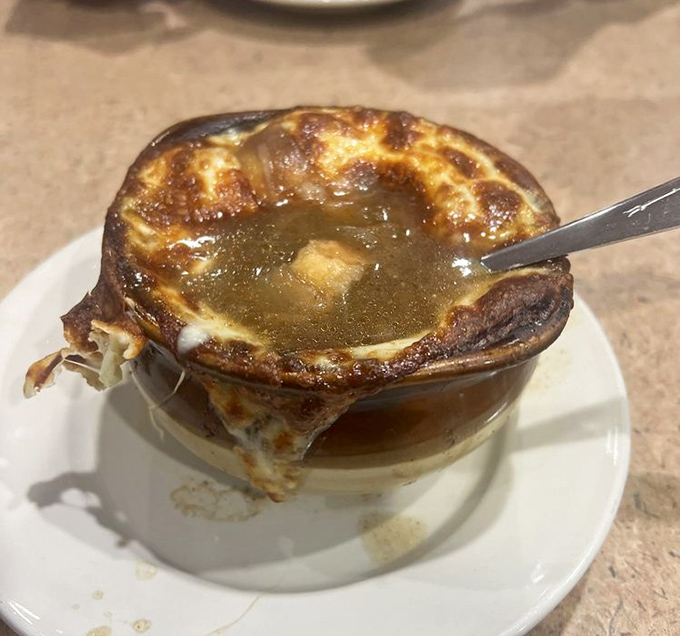 French onion soup that's committed to the cheese pull. That glorious moment when your spoon breaks through the broiled canopy into the savory broth below.