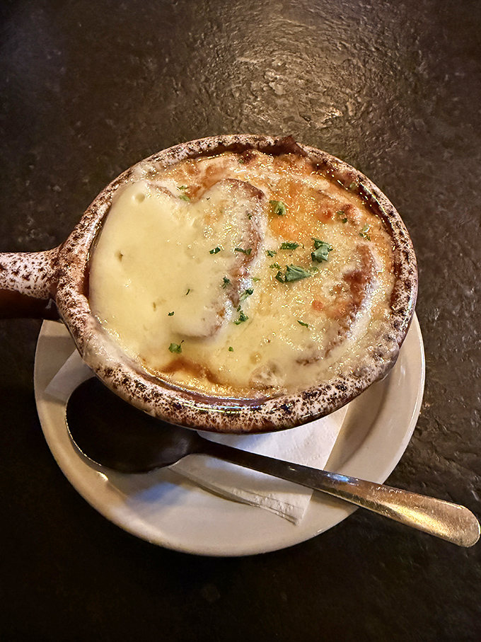 French onion soup that's having its Broadway moment&mdash;the cheese pulling a dramatic curtain call over caramelized onions and rich broth. Standing ovation guaranteed.