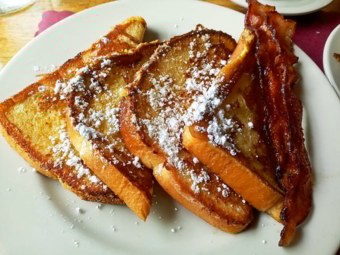 French toast that's achieved that mythical balance&mdash;crispy edges, custardy center, and enough powdered sugar to make your dentist wince approvingly.