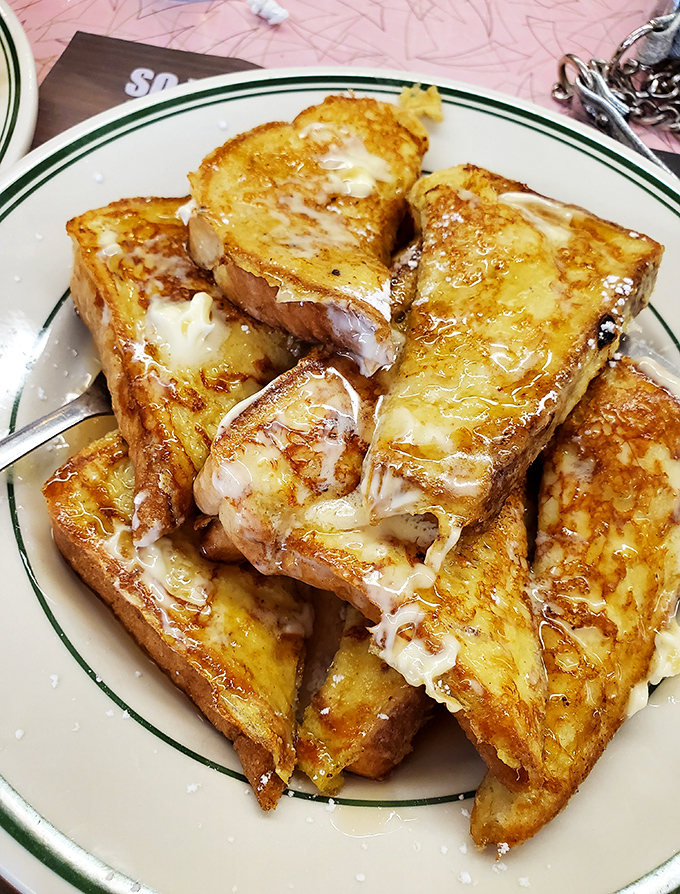 French toast that doesn't need a passport to impress&mdash;thick-cut, golden-brown, and dripping with melty goodness that would make your cardiologist wince.