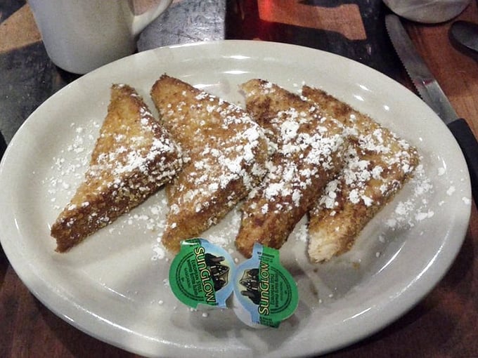 French toast dusted with powdered sugar&mdash;simple, classic, and arranged with the kind of precision that suggests they know exactly what they're doing.