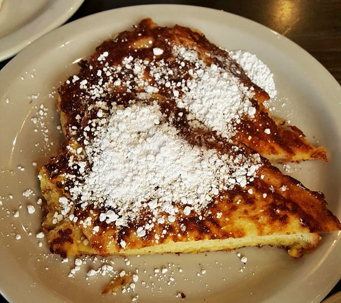 French toast that's achieved the perfect golden-brown graduation with honors. That powdered sugar sprinkle? The diploma for excellence in breakfast arts.
