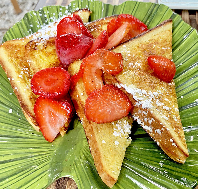 French toast that doesn't just arrive&mdash;it makes an entrance, dressed in strawberries and powdered sugar like it's heading to breakfast prom.