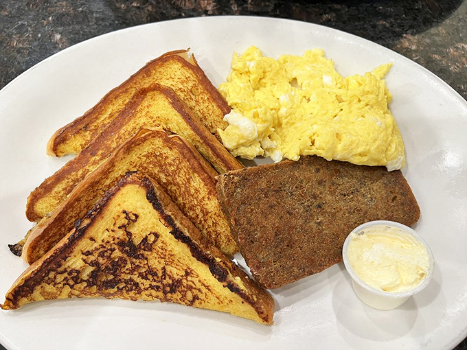 Golden-brown French toast that's achieved that mythical balance&mdash;crispy exterior, custardy interior. The scrapple alongside is pure Pennsylvania breakfast poetry.