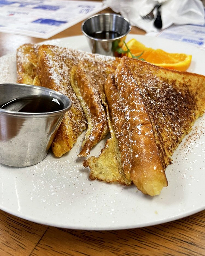 French toast that's achieved the perfect golden ratio&mdash;crispy edges, custardy center, and enough powdered sugar to leave evidence on your shirt.