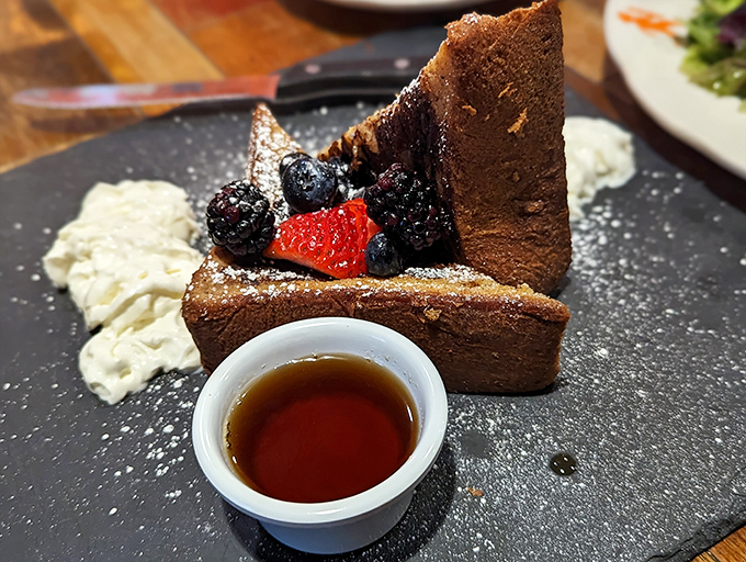 The star of the show: French toast that's architectural in its height, artistic in its presentation, and absolutely transcendent in flavor.