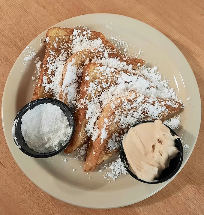 French toast dusted with powdered sugar and served with whipped cream &ndash; because sometimes breakfast should feel like getting away with dessert.