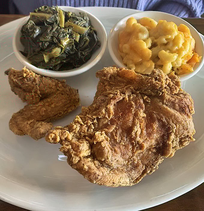 Fried chicken so perfectly golden it deserves its own trophy, accompanied by collards and mac & cheese that refuse to be upstaged.