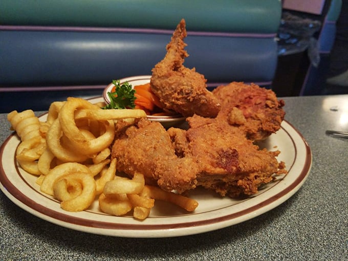 Fried chicken that crackles with each bite, paired with curly fries that could double as edible Slinkys. This is why diets were meant to be broken.