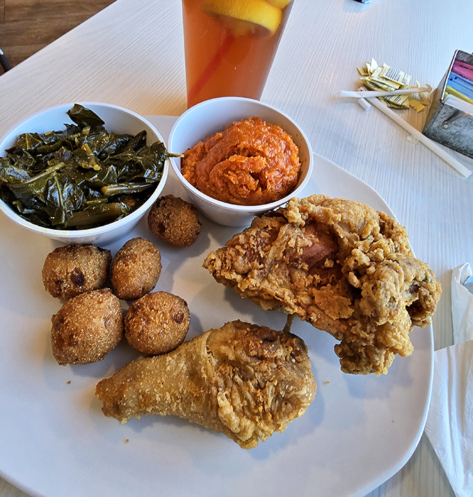Southern fried chicken, hush puppies, and collard greens&mdash;the holy trinity of comfort food. Calories worth every delicious minute on the treadmill tomorrow.