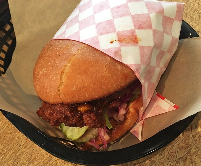 The perfect fried chicken sandwich doesn't exi&mdash; Oh wait, here it is, peeking out from checkered paper like it knows exactly how good-looking it is.