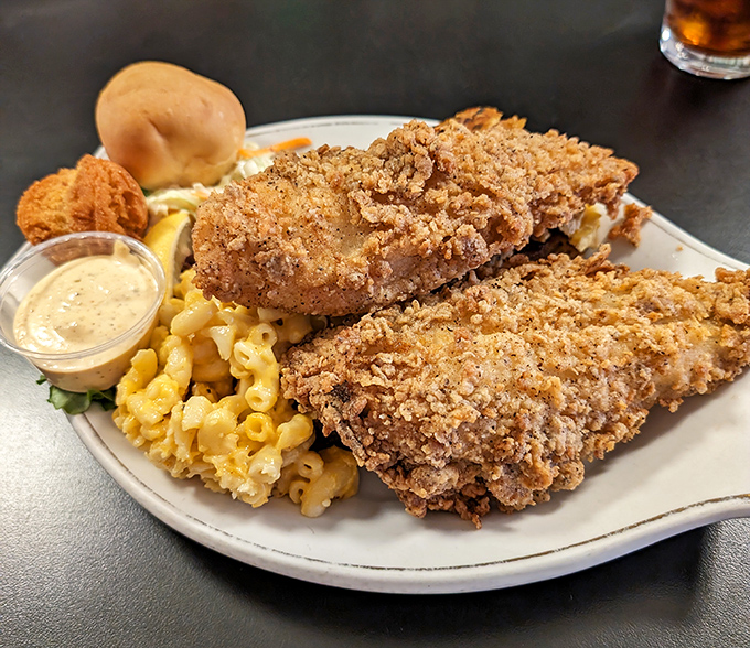 Fried chicken with a crust that audibly crackles, nestled beside mac and cheese that's clearly on a first-name basis with real cheddar.