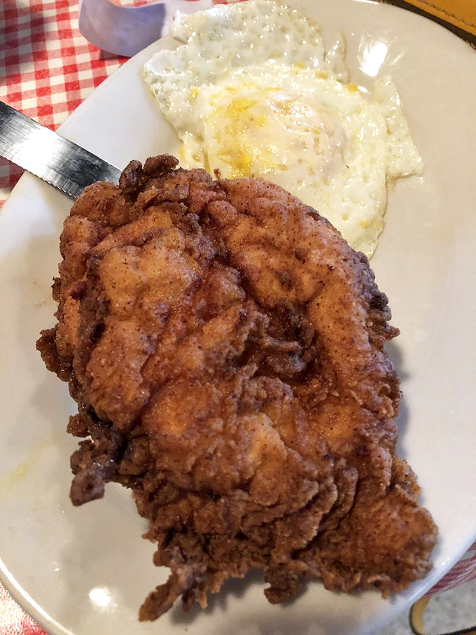 Country fried steak with that golden-brown crust shattering under your fork is the kind of morning revelation that makes you question why we ever invented cereal.