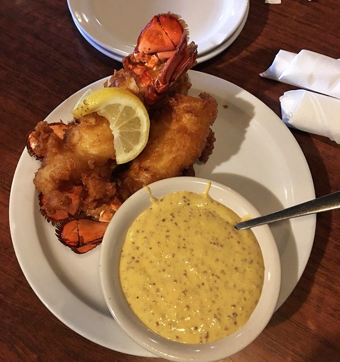 The ocean meets the South. Golden-fried lobster tails with a side of mustard sauce prove this steakhouse knows its way around seafood too.