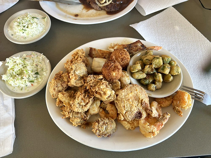 This isn't just a seafood platter; it's a celebration of the Gulf on a plate. The crispy coating whispers rather than shouts, letting the ocean's bounty take center stage. 