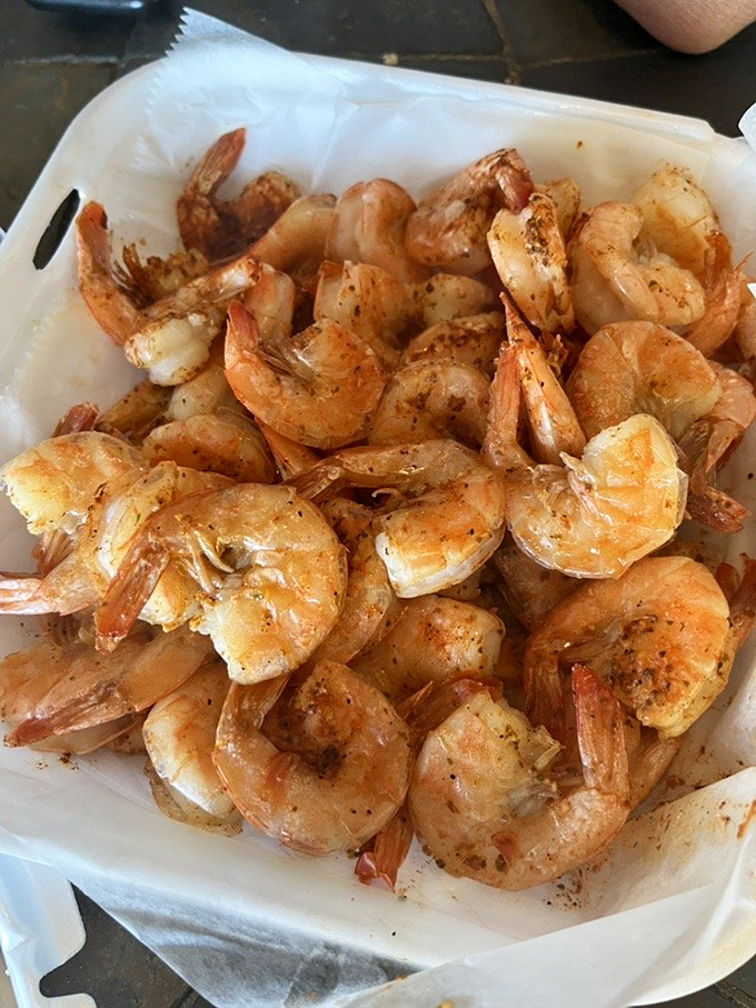 These shrimp aren't just steamed; they're transformed into little pink vessels of seasoned perfection that'll haunt your dreams