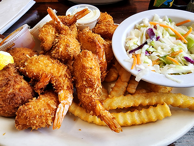 Coconut shrimp that could make a pescatarian weep with joy. Crispy, golden coating giving way to perfectly cooked shrimp&mdash;seafood alchemy at its finest.