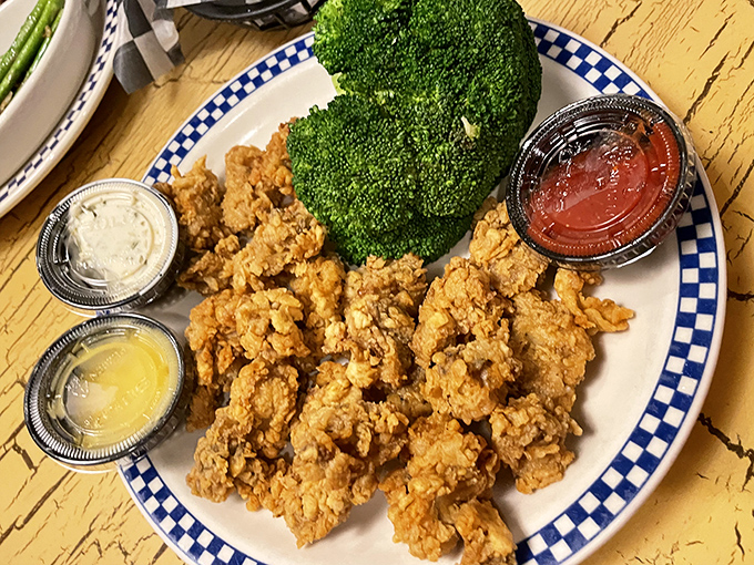 Golden-fried shrimp that crunch like autumn leaves, paired with broccoli that's there to ease your conscience but will be eaten last.