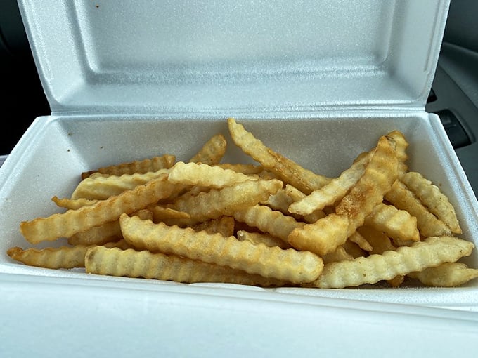 Crinkle-cut fries that achieve the perfect balance of crispy exterior and fluffy interior—the supporting actors that steal the show.