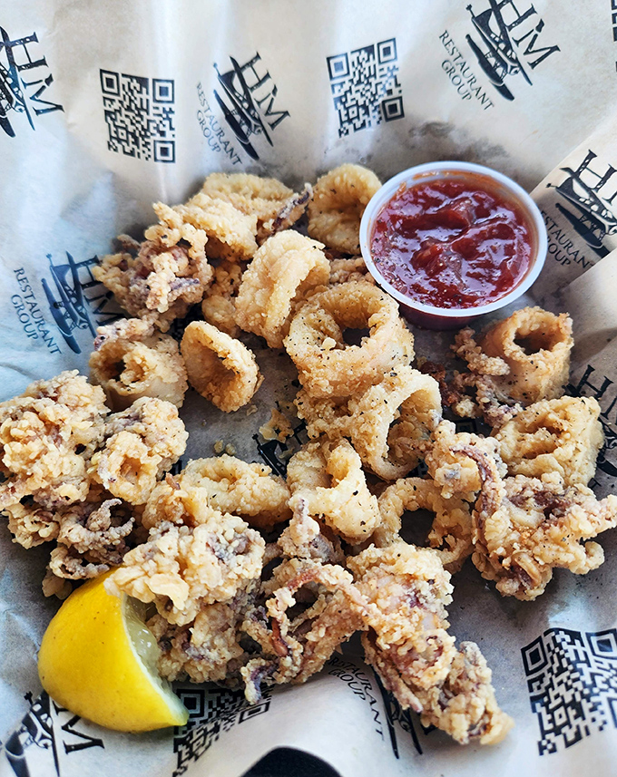 Fried calamari that's tender inside, crunchy outside &ndash; the way all good relationships should be. That lemon wedge isn't just for show, folks.