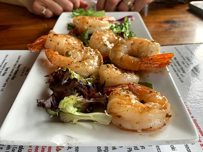 These shrimp aren't just garlic-kissed, they're having a full-blown romance with flavor atop a bed of fresh greens.