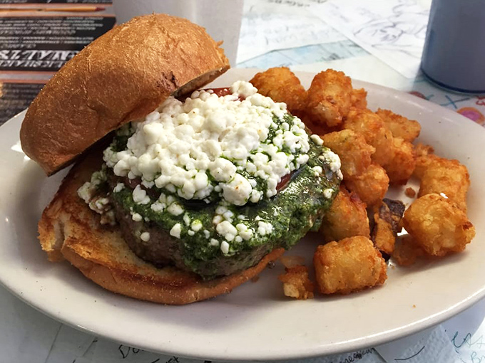 The goat cheese burger arrives like a sophisticated cousin who went to culinary school in Europe but still knows how to have fun.