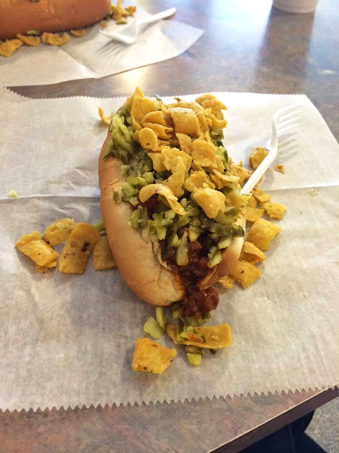 When your hot dog requires strategic eating plans and comes with Fritos as both garnish and backup catchers, you know you've entered the big leagues of frank construction.