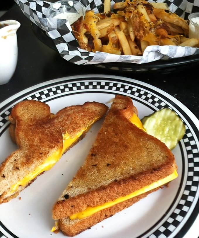 Grilled cheese elevated to art form&mdash;golden-brown perfection with melty American cheese that would make June Cleaver proud. Those fries deserve their own fan club.