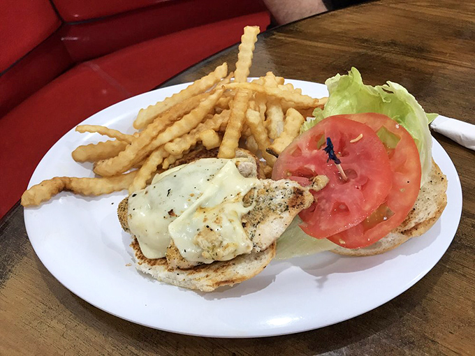 A chicken sandwich that actually looks like it was made by someone who cares about you. Those crinkle-cut fries aren't just sides&mdash;they're supporting characters.