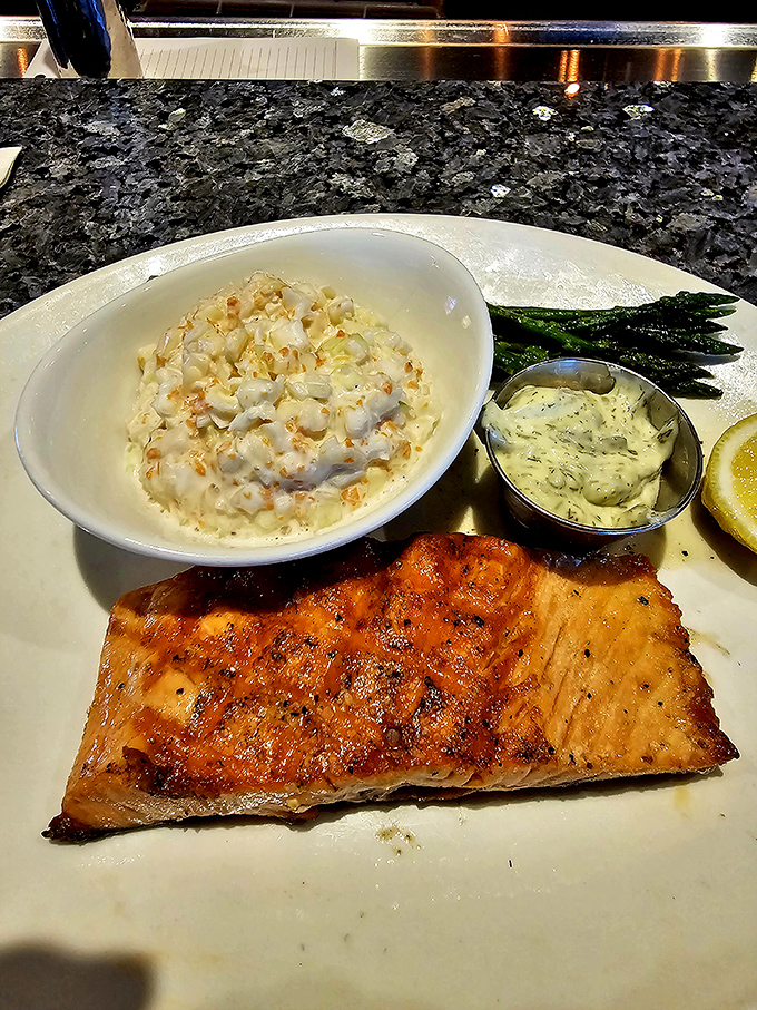 Perfectly grilled salmon with creamy corn and asparagus—proof that sometimes the simplest preparations let great ingredients sing their own delicious song.