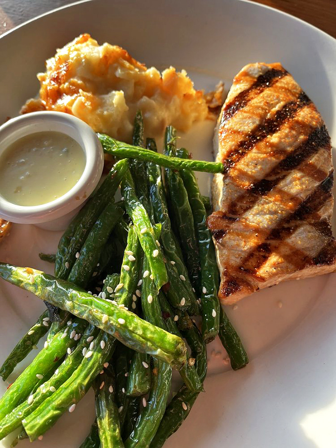That perfect grill mark geometry on fresh swordfish isn't just for show &ndash; it's the visual promise of what your taste buds are about to experience.