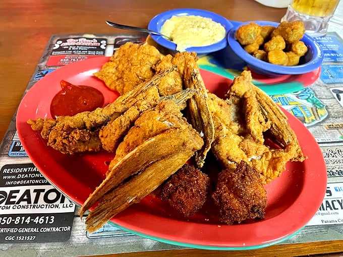 Golden-fried grouper throats on a no-nonsense red plate&mdash;proof that the best parts of fish aren't always the ones you learn about in cookbooks.