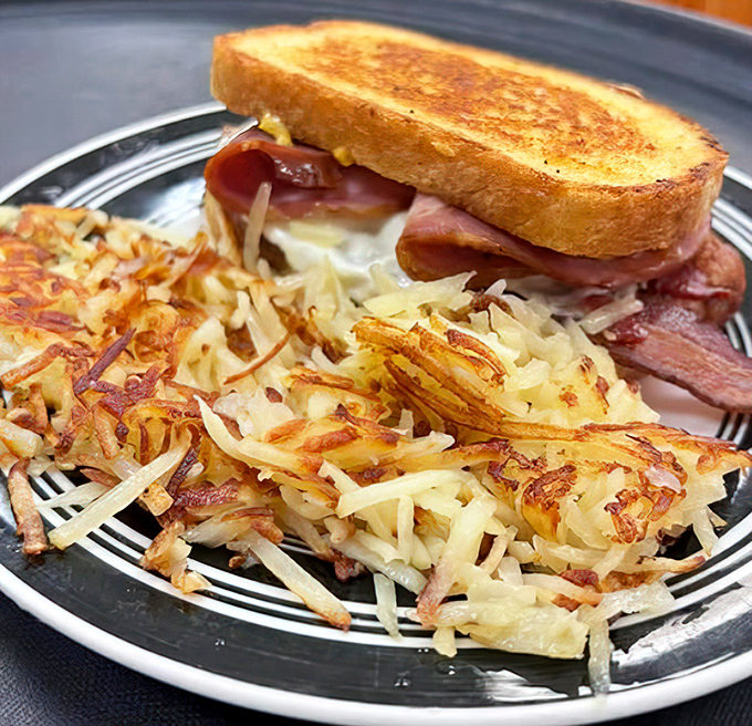 The stars of the show: hash browns with that magical crispy-outside, tender-inside quality that's harder to achieve than world peace but infinitely more satisfying.