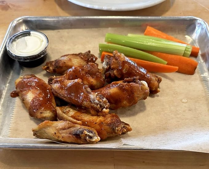 These wings aren't just glazed, they're having their moment in the spotlight. The celery and carrots are just there as witnesses.