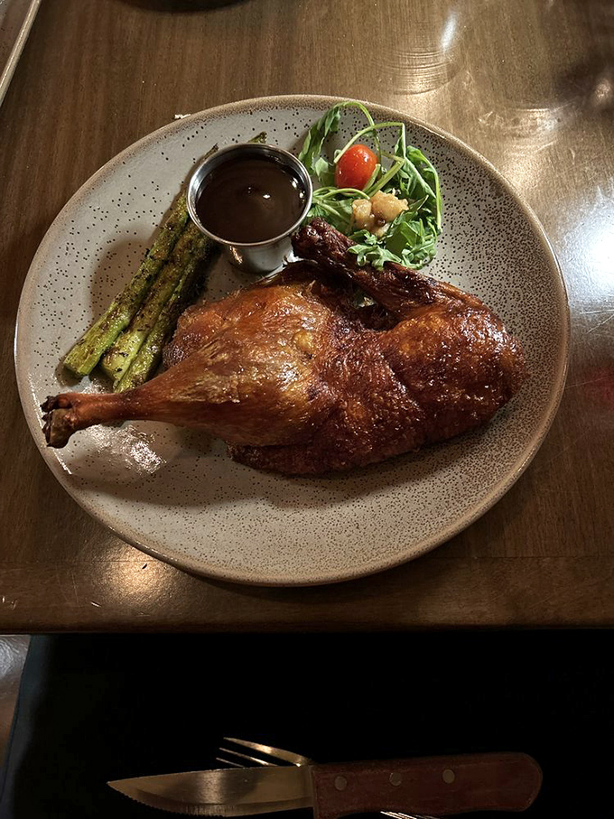 Duck so perfectly crisp it makes you wonder if poultry was actually invented just for this moment, served with asparagus that actually tastes like asparagus should.