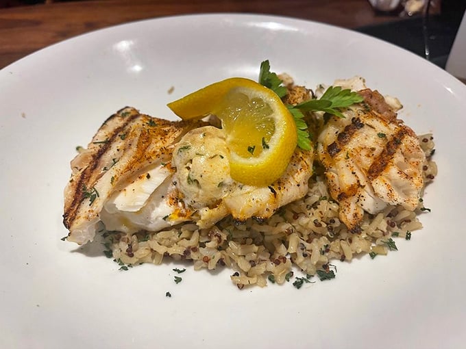 Grilled fish perfection resting on a bed of rice&mdash;proof that simplicity, when executed flawlessly, creates the most memorable meals.