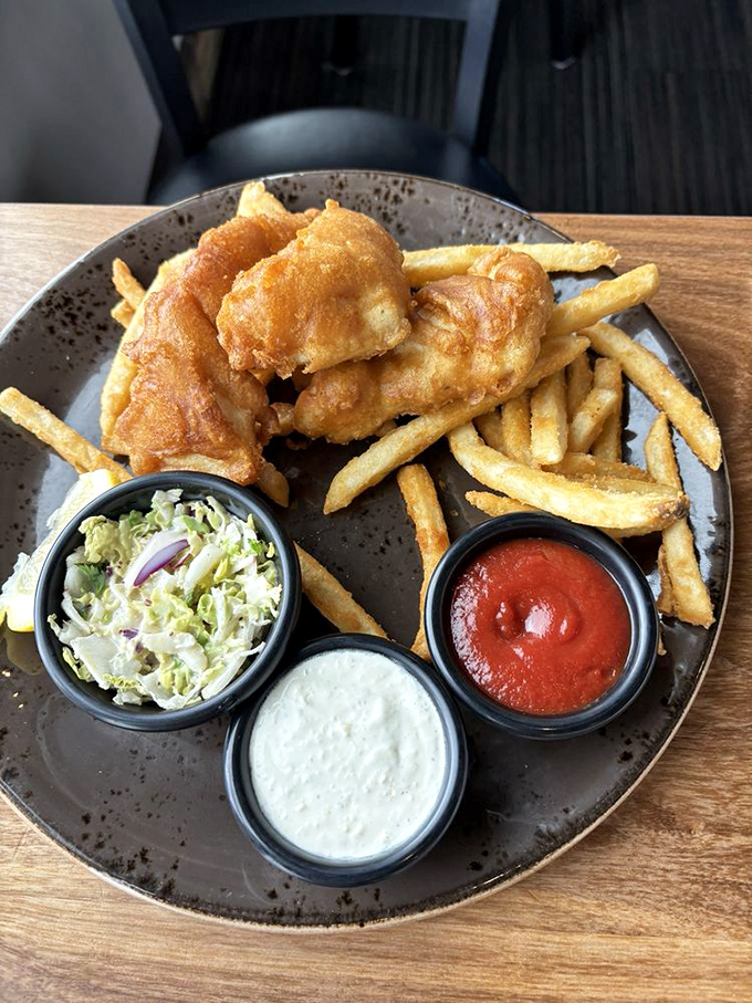 Fish and chips elevated to an art form. The halibut's delicate crunch gives way to pearly white flesh that would make Neptune himself weep with joy.