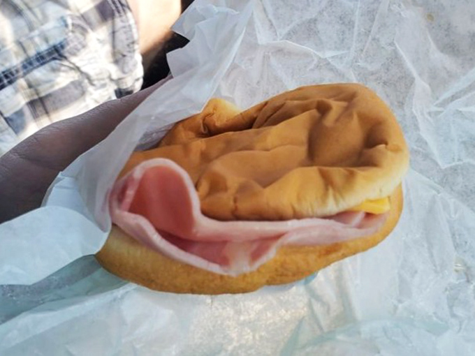 This ham masterpiece showcases thick-cut perfection that transforms ordinary lunch into an extraordinary memory.